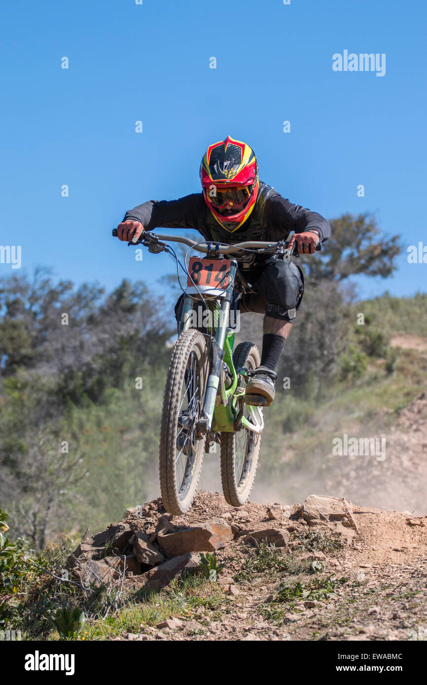 Downhill competition, Biker jumps fast in the countryside Stock Photo ...