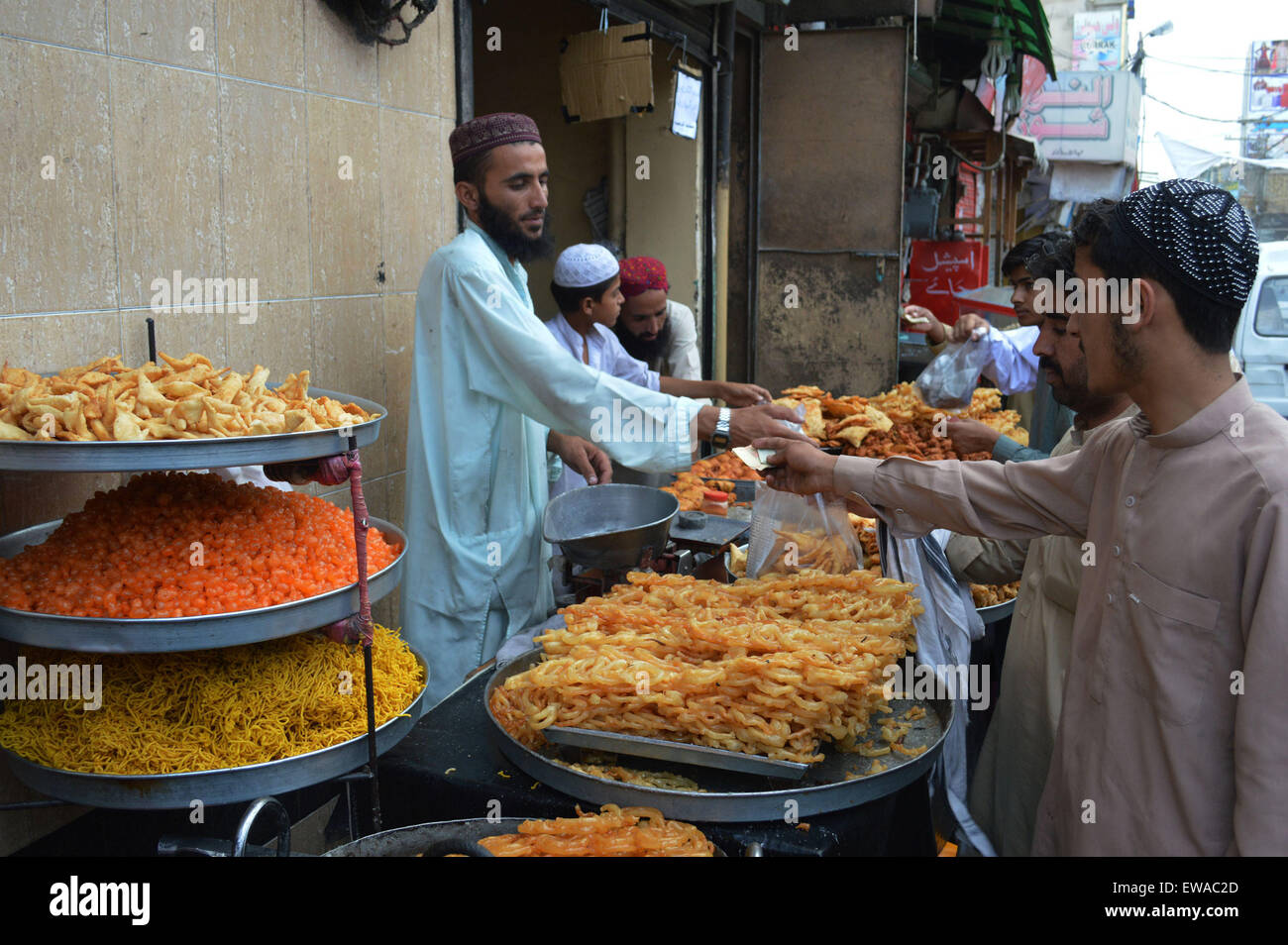 Quetta. 21st June, 2015. People buy iftar food before breaking their ...