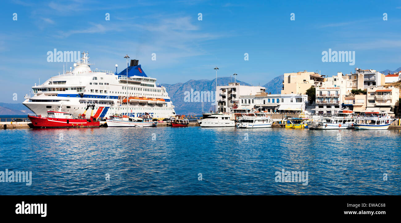 AGIOS NIKOLAOS, GREECE. Cruise ship and boats in the port of old town ...