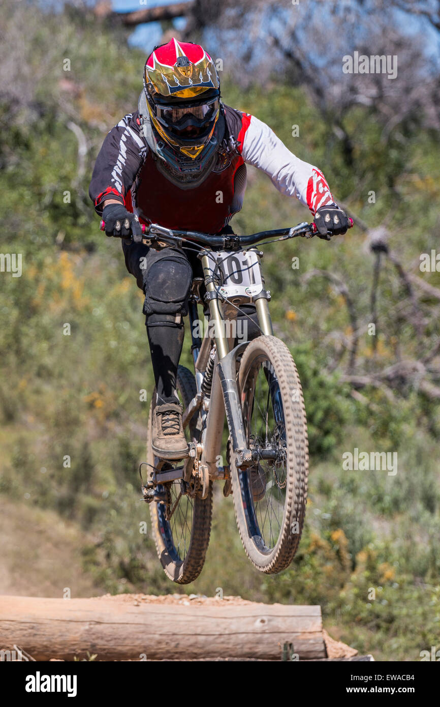 Downhill competition, Biker jumps fast in the countryside Stock Photo ...