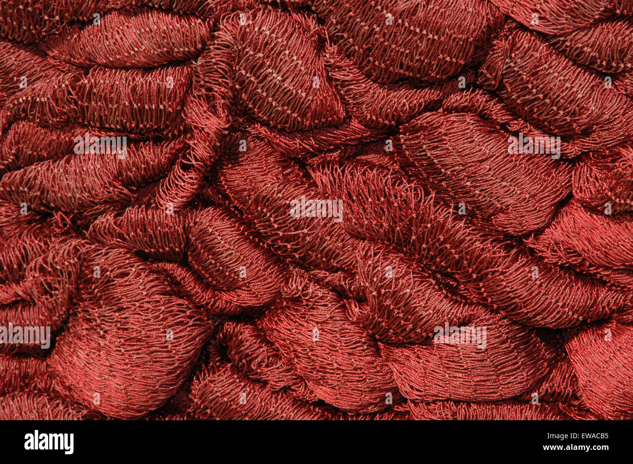 stacked textured red fishing nets Stock Photo - Alamy