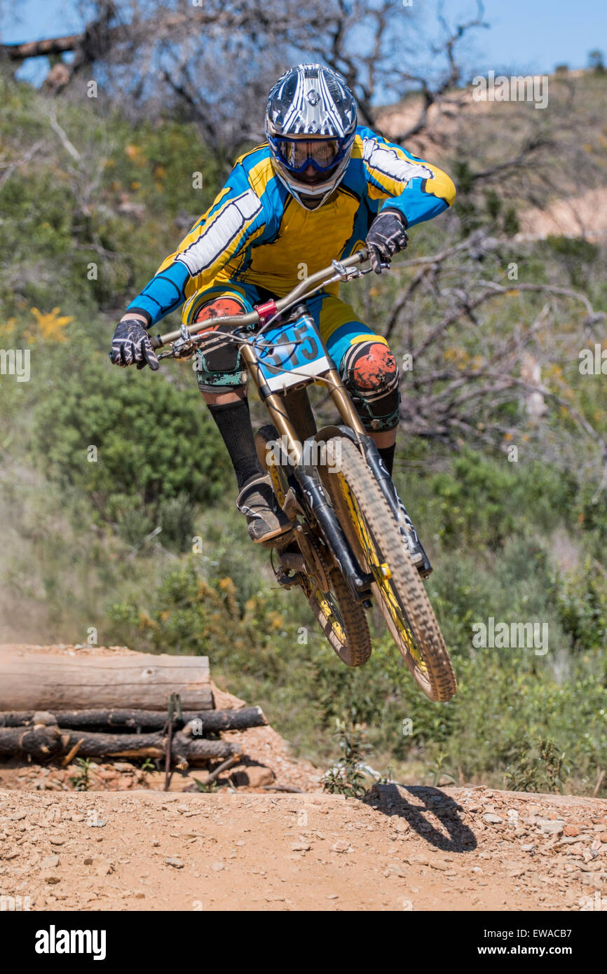 Downhill competition, Biker jumps fast in the countryside Stock Photo ...