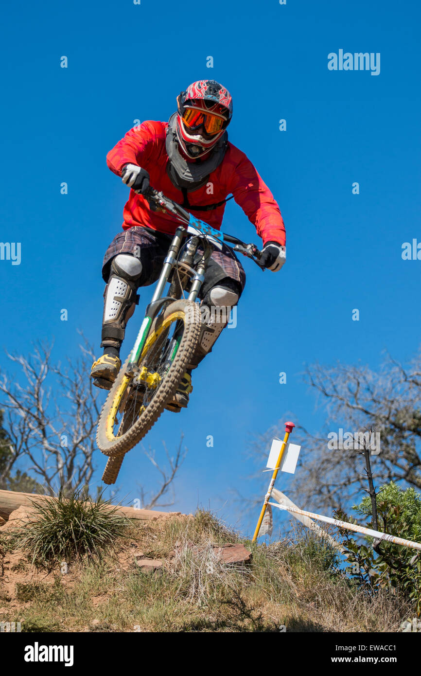 Downhill competition, Biker jumps fast in the countryside Stock Photo ...