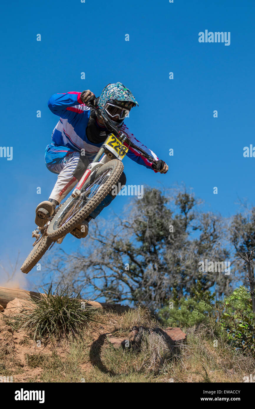 Downhill competition, Biker jumps fast in the countryside Stock Photo ...