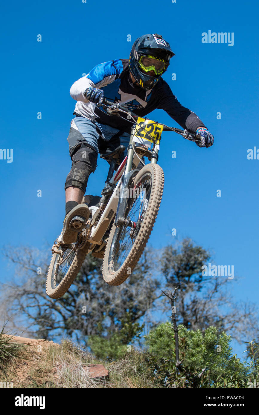 Downhill competition, Biker jumps fast in the countryside Stock Photo ...