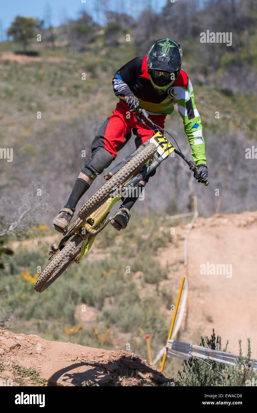 Downhill competition, Biker jumps fast in the countryside Stock Photo ...