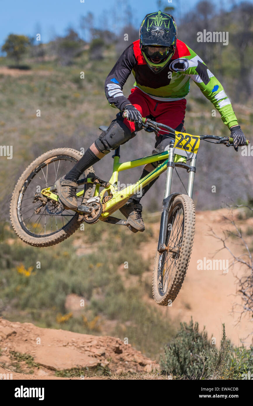 Downhill competition, Biker jumps fast in the countryside Stock Photo ...