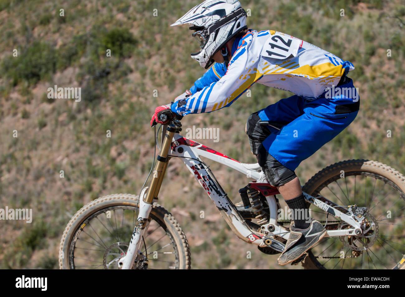 Downhill competition, Biker jumps fast in the countryside Stock Photo ...