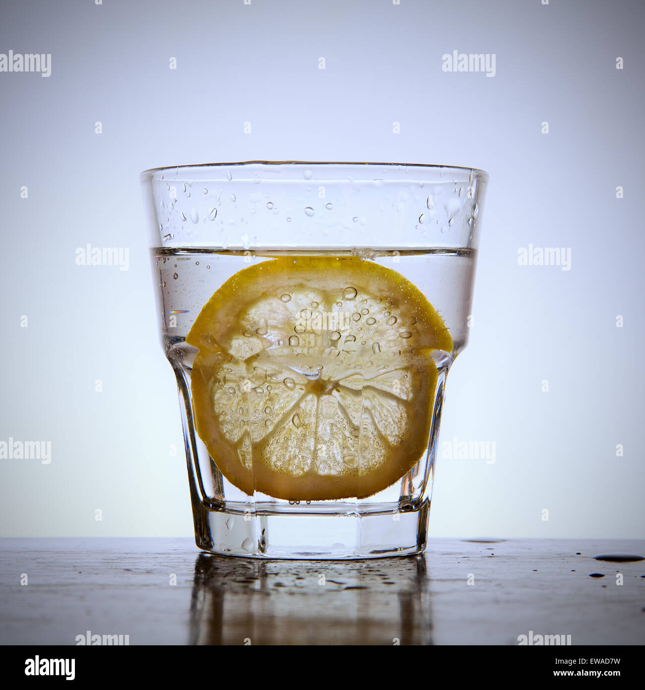 Water Glass with a lemon slice Stock Photo - Alamy