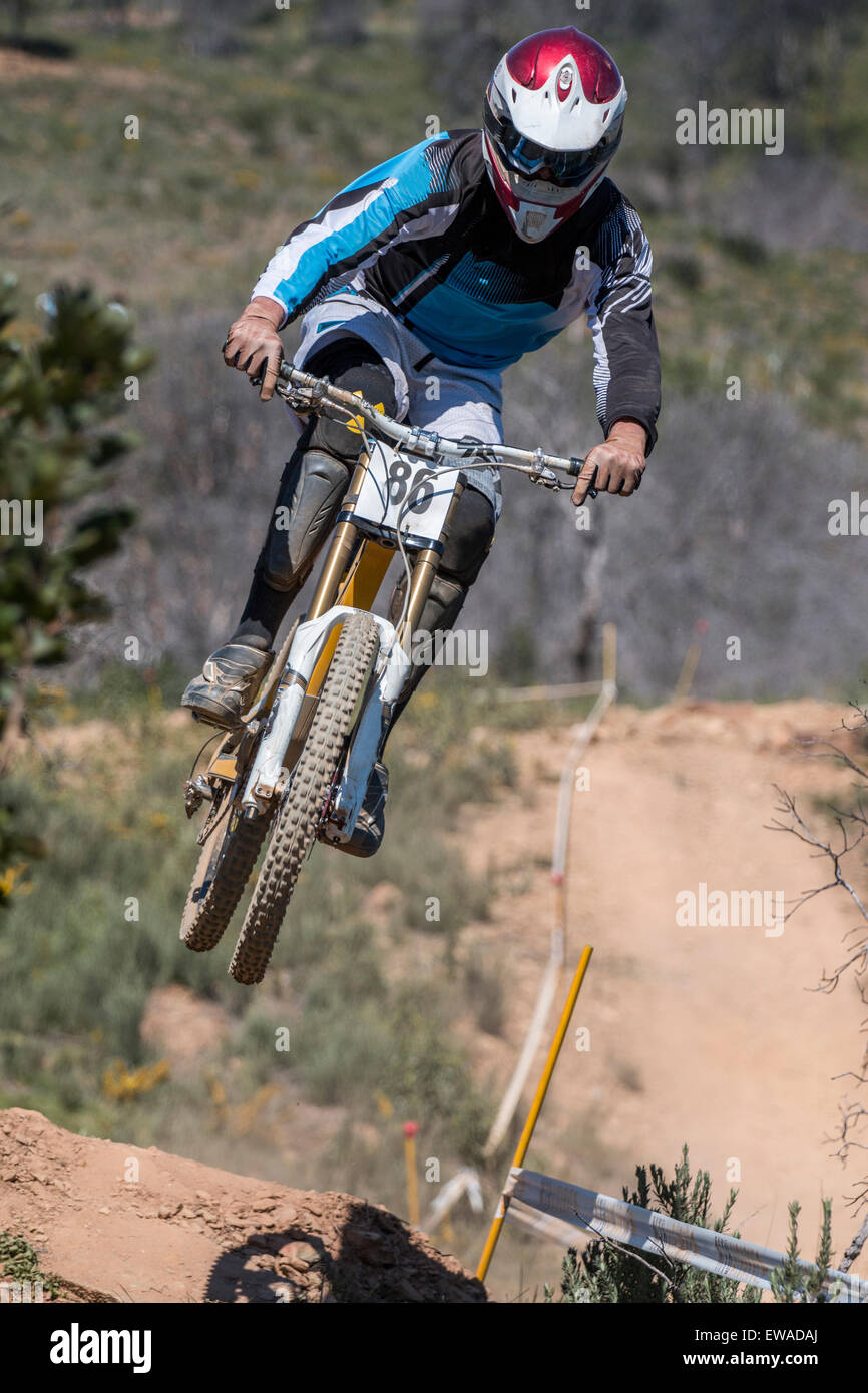 Downhill competition, Biker jumps fast in the countryside Stock Photo ...
