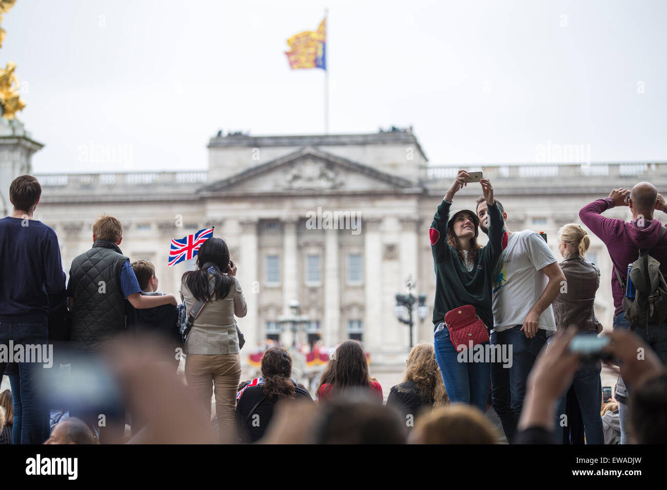 Crowds gather as Queen Elizabeth II and other members of the Royal ...