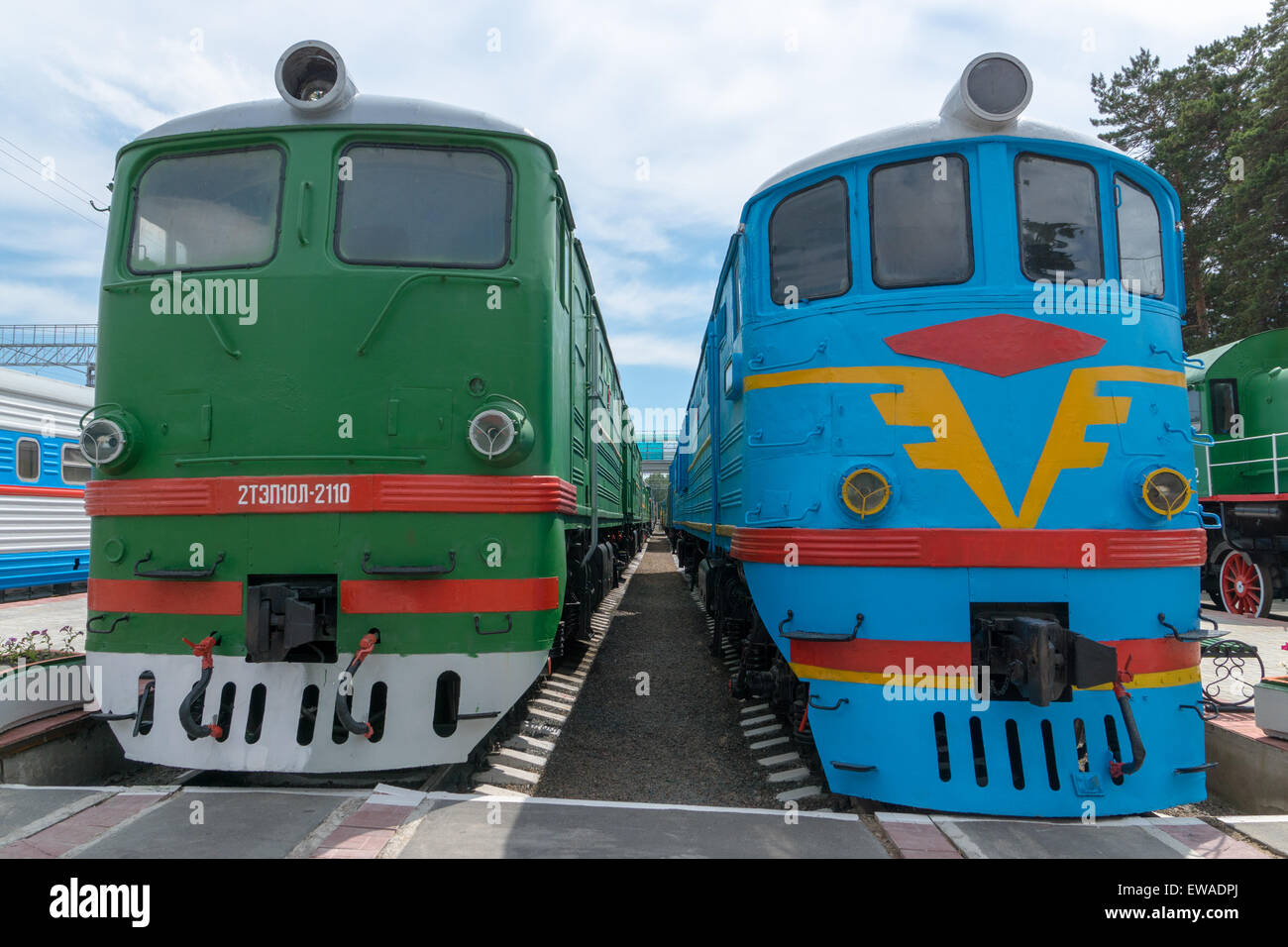 front of green and blue diesel locomotives at train station Stock Photo ...