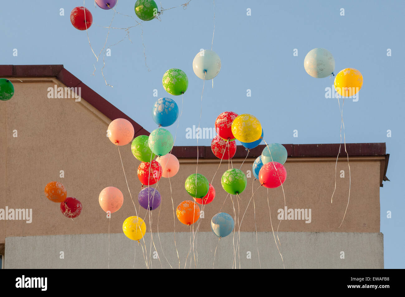 Baloons in air on sunny summer day against blue sky Stock Photo - Alamy