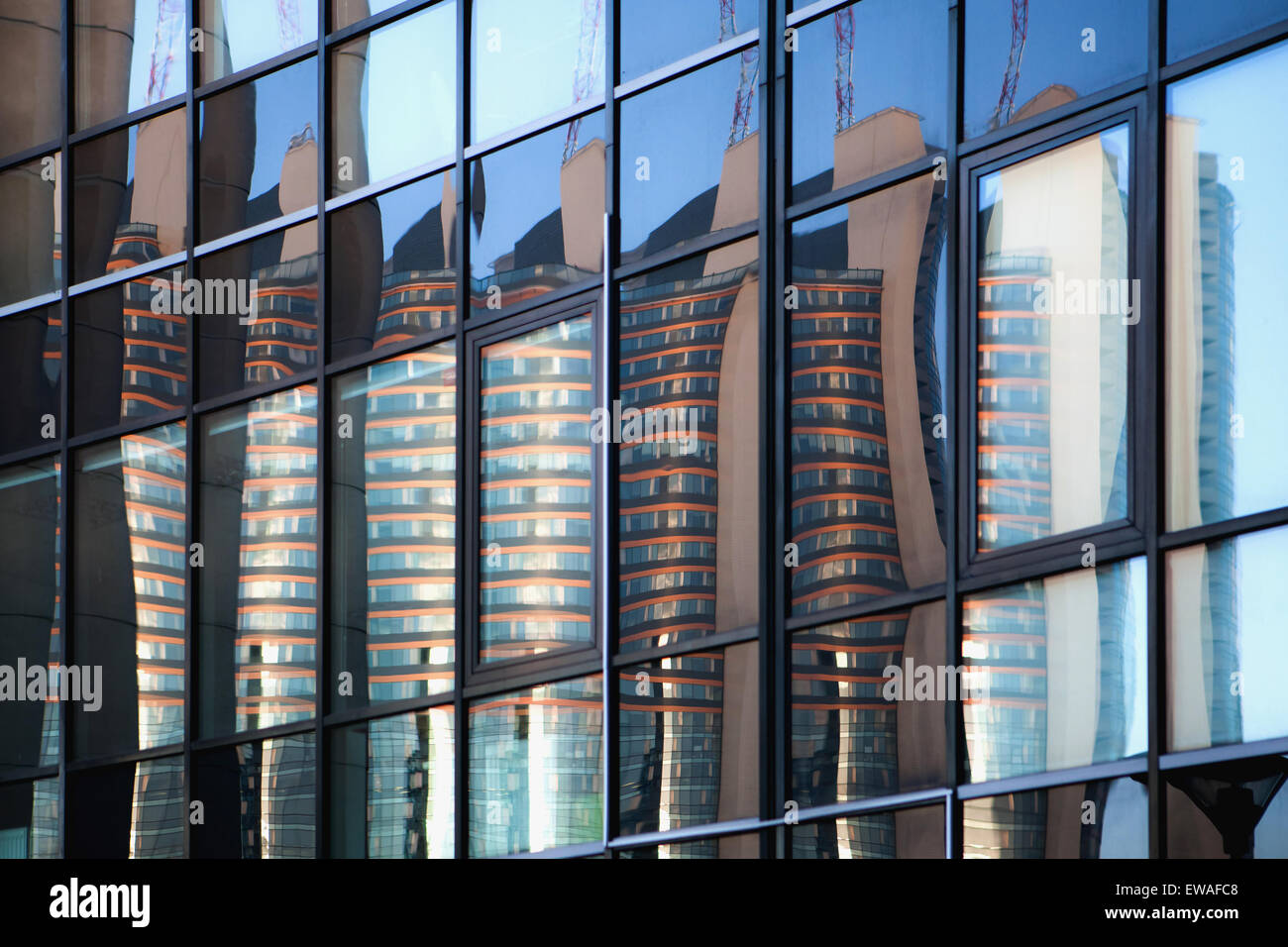 Skyscraper reflexion in windows Stock Photo - Alamy