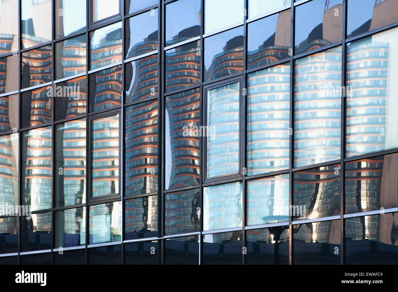 Skyscraper reflexion in windows Stock Photo - Alamy