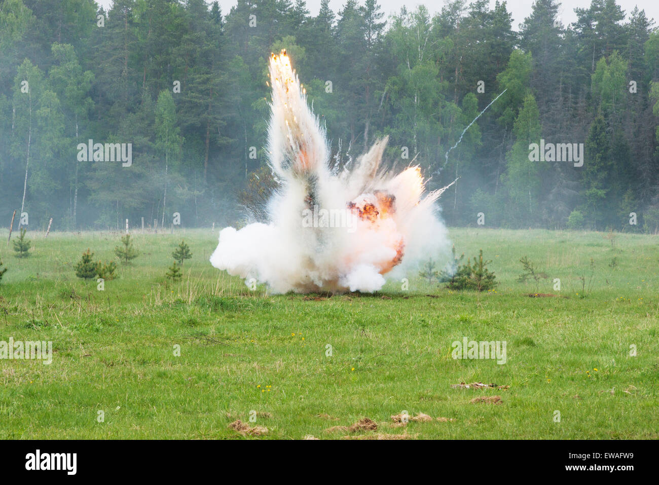 Image of explosion on field during military actions Stock Photo - Alamy
