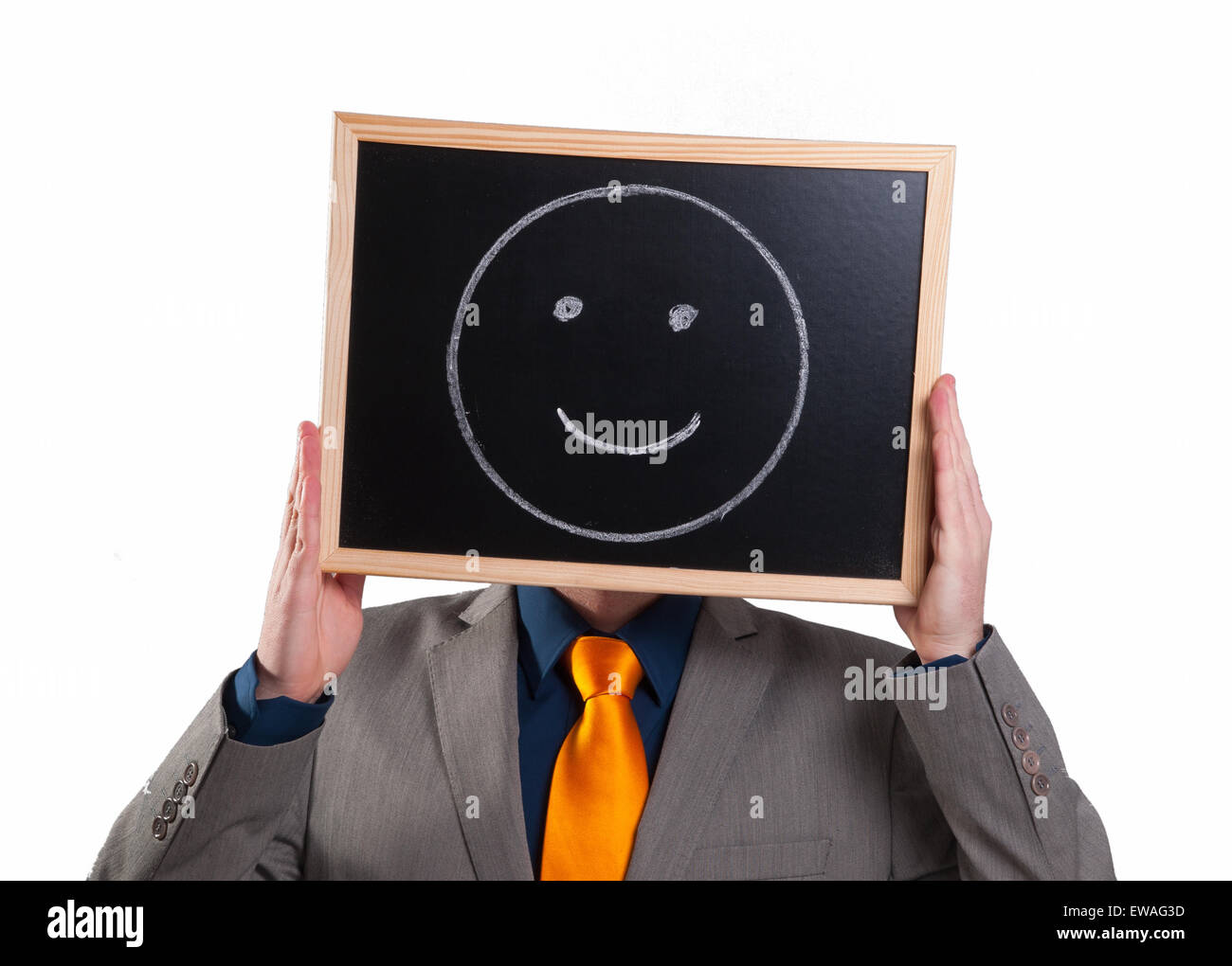 Businessman hiding his face with a white billboard with a smiley face ...