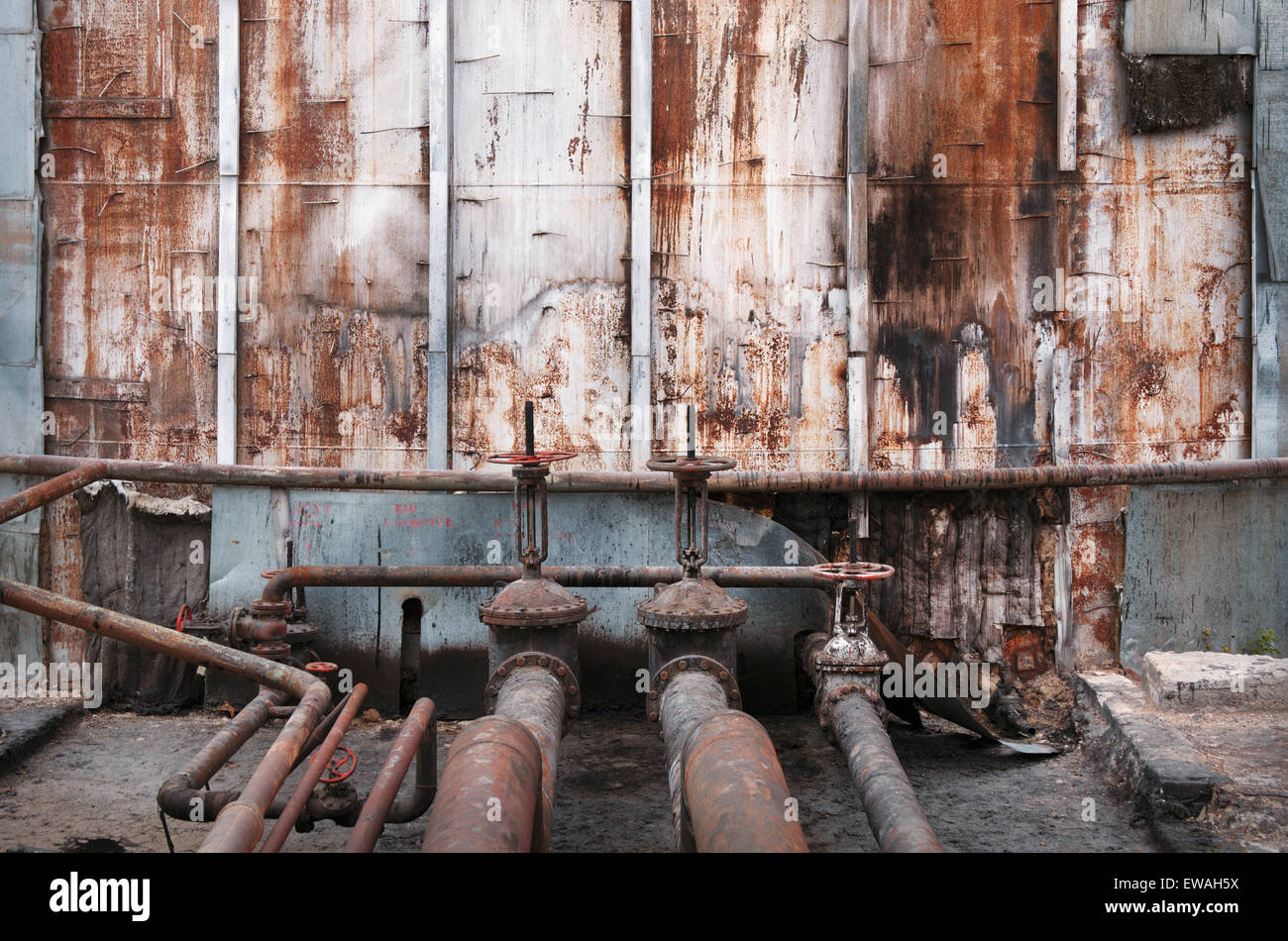 old pipes and valves at an oil terminal Stock Photo - Alamy