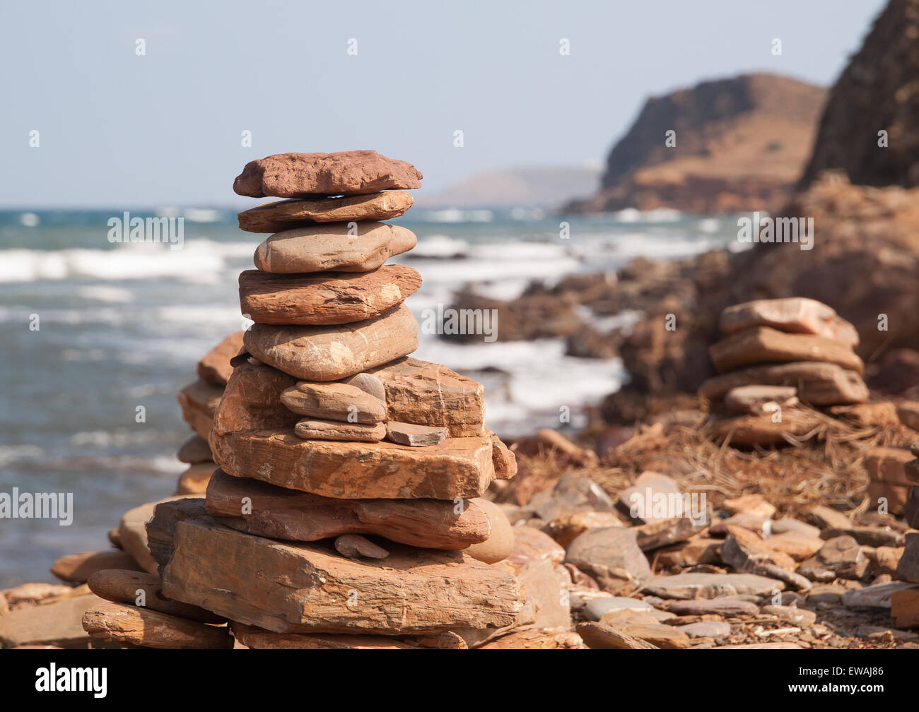 Pile of stones in Pregonda beach, Menorca, Spain Stock Photo - Alamy
