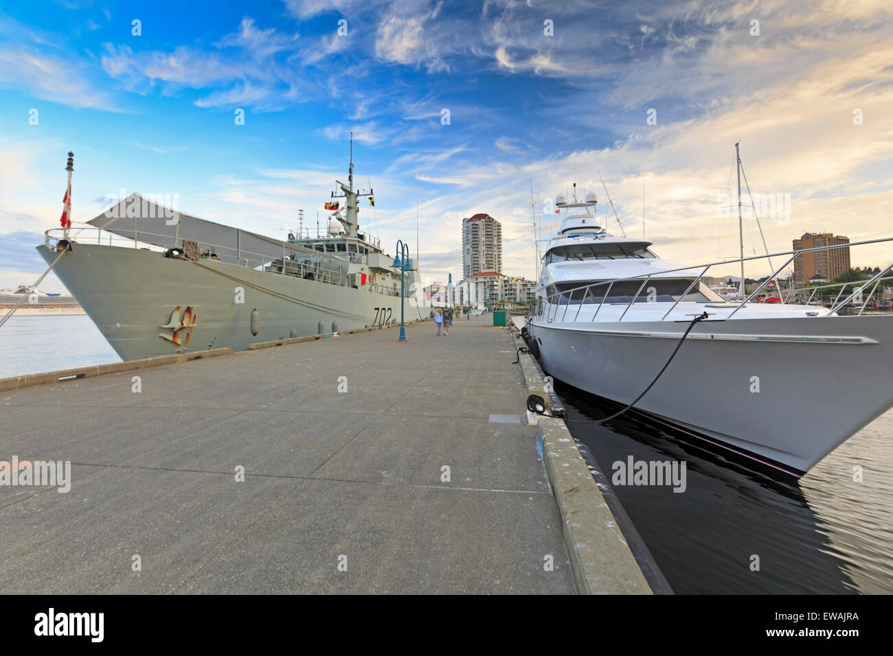 HMCS Nanaimo tied up beside luxury yacht at marina, Nanaimo, British ...