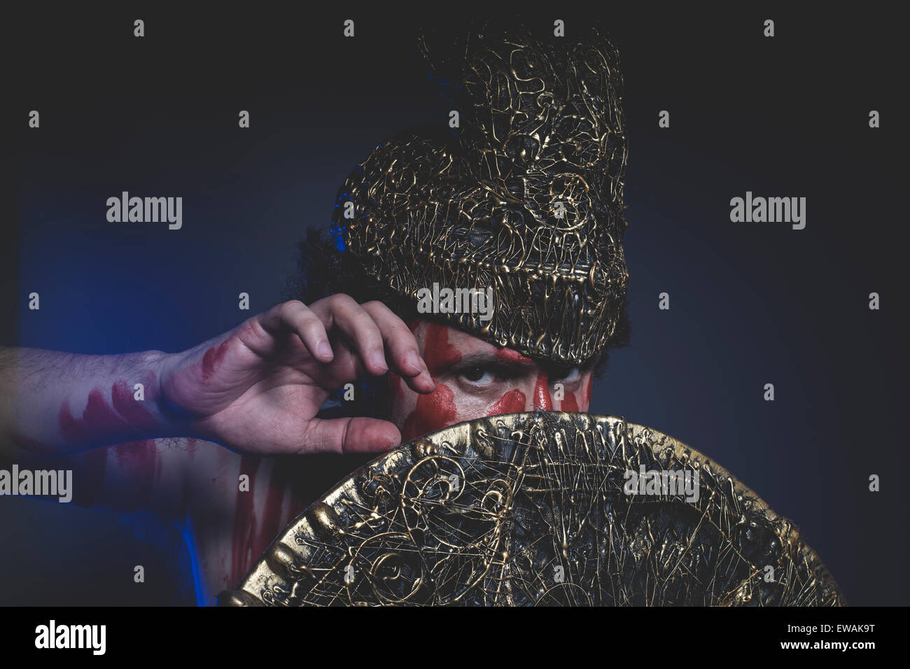 Medieval, bearded man warrior with metal helmet and shield, wild Viking ...