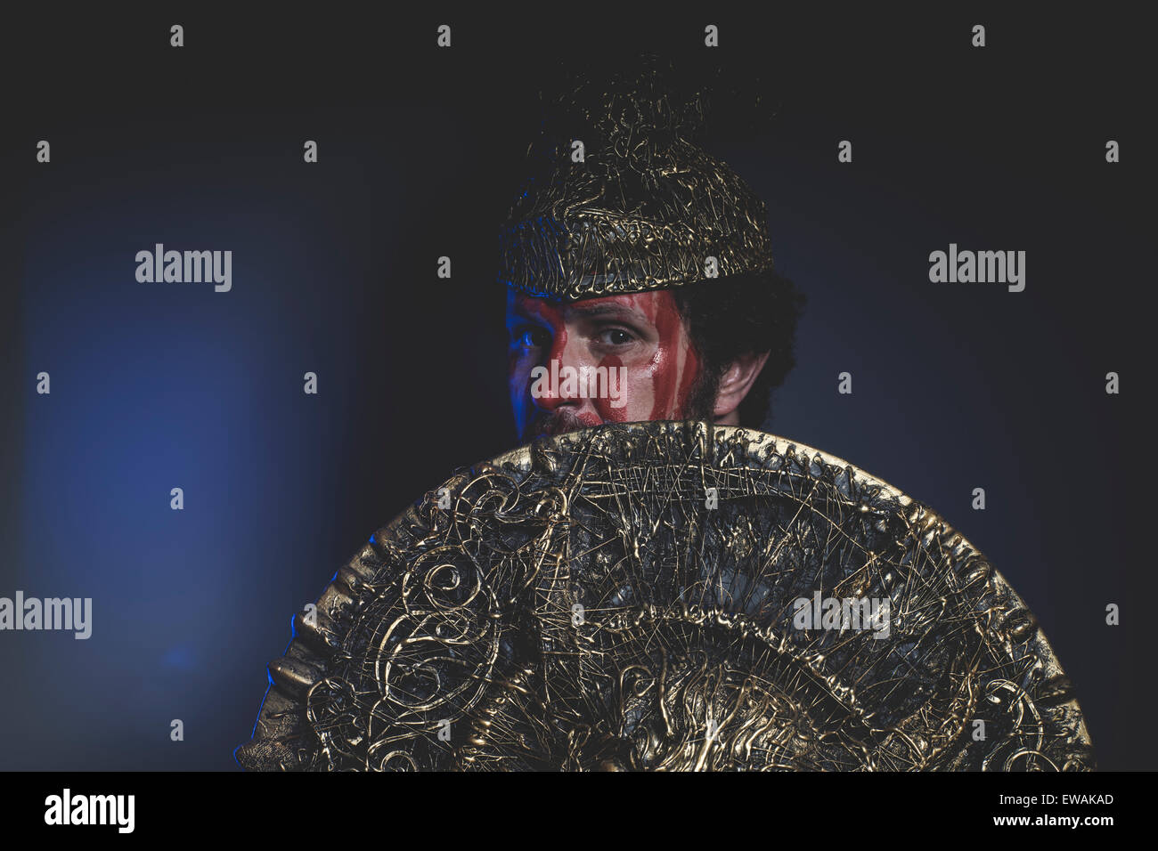Magic, bearded man warrior with metal helmet and shield, wild Viking ...