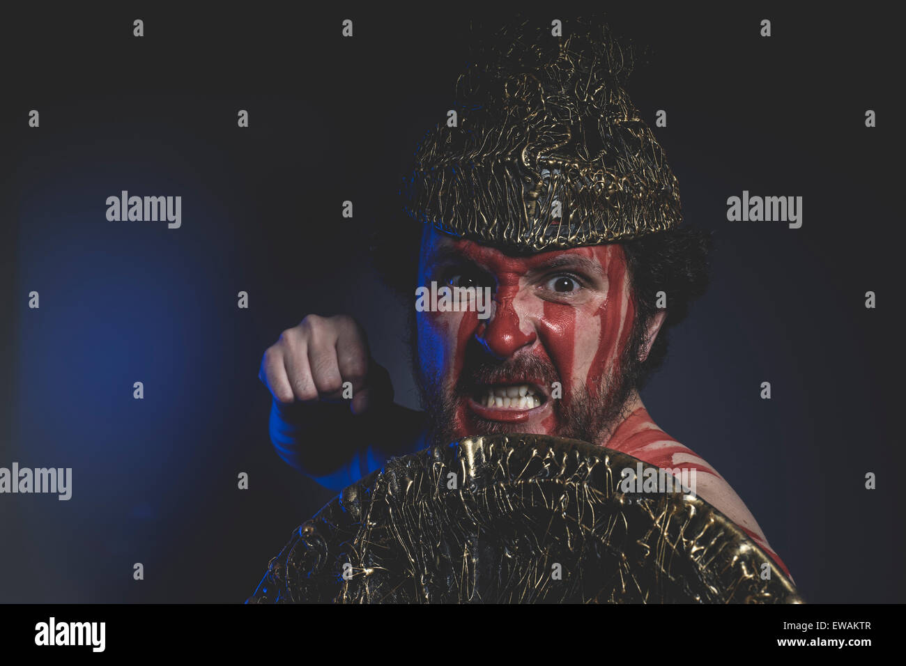 Medieval, bearded man warrior with metal helmet and shield, wild Viking ...