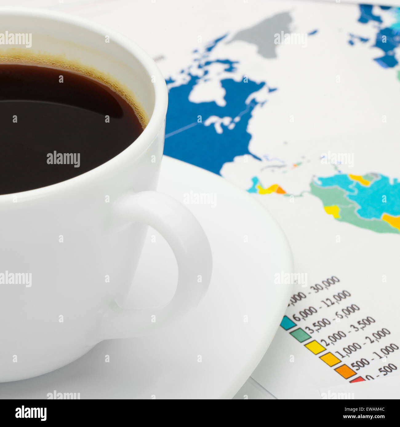Coffee cup over world map - close up shot Stock Photo - Alamy