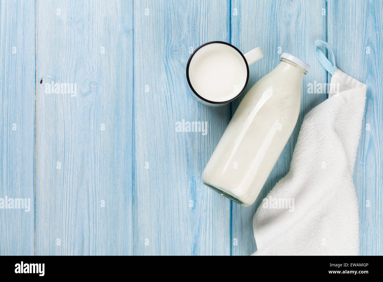 Milk cup and bottle on wooden table. Top view with copy space Stock ...