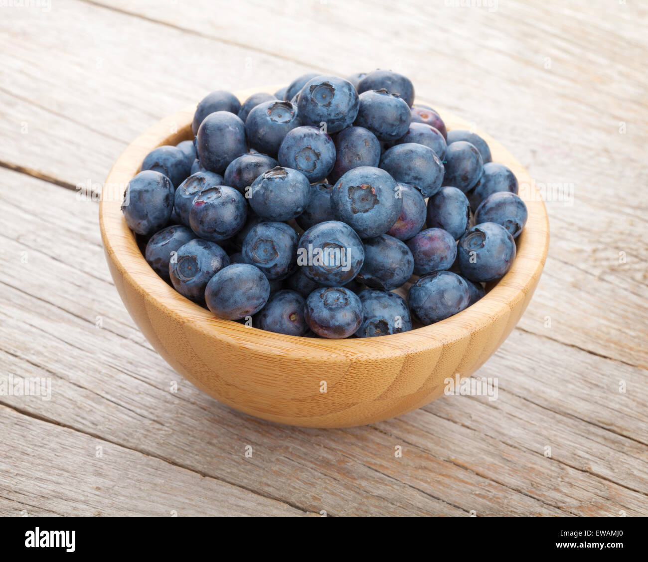 Blueberries in bowl on wooden table background Stock Photo - Alamy