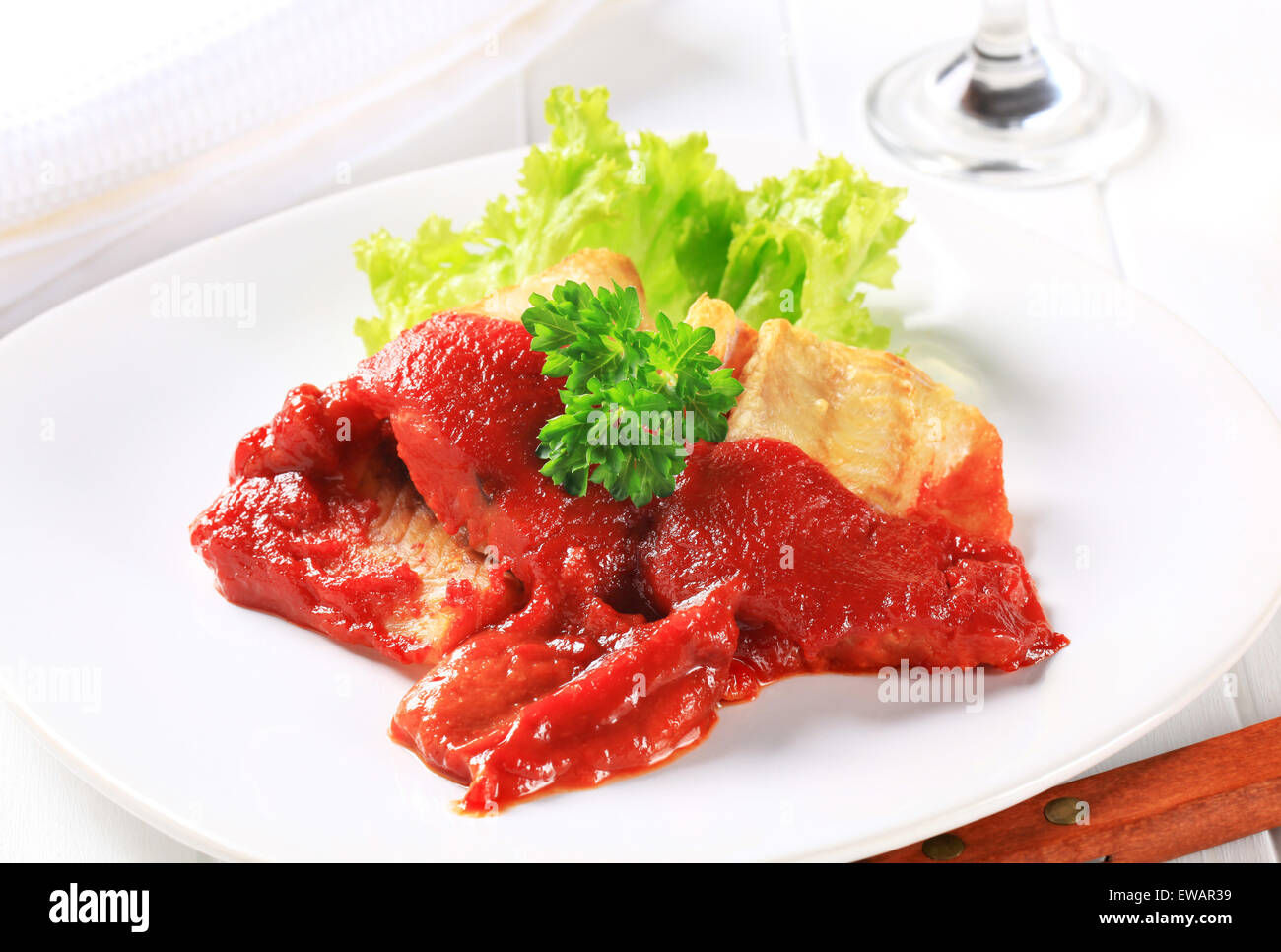 White fish fillets in rich tomato sauce Stock Photo - Alamy
