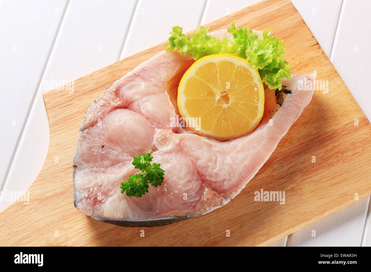 Fresh fish steak with lemon Stock Photo - Alamy