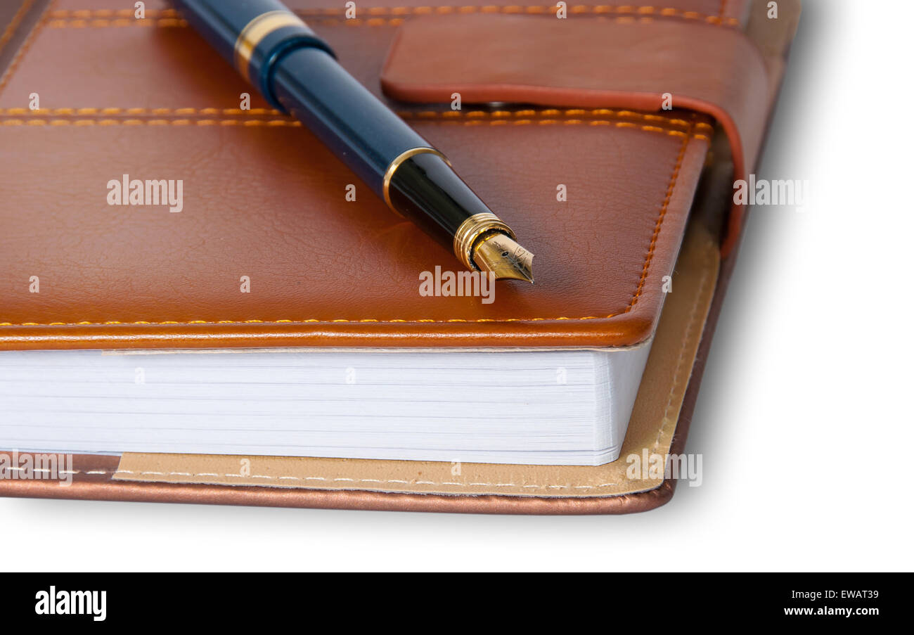 Closeup fountain pen on top of the closed notebook isolated on white ...