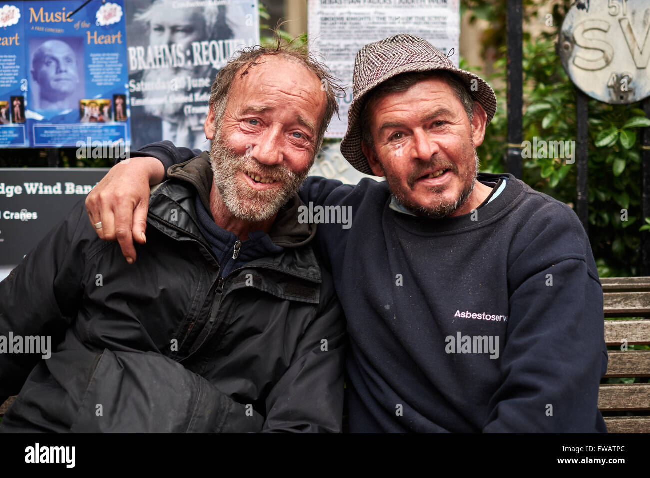 Two homeless men sitting on a bench Stock Photo - Alamy