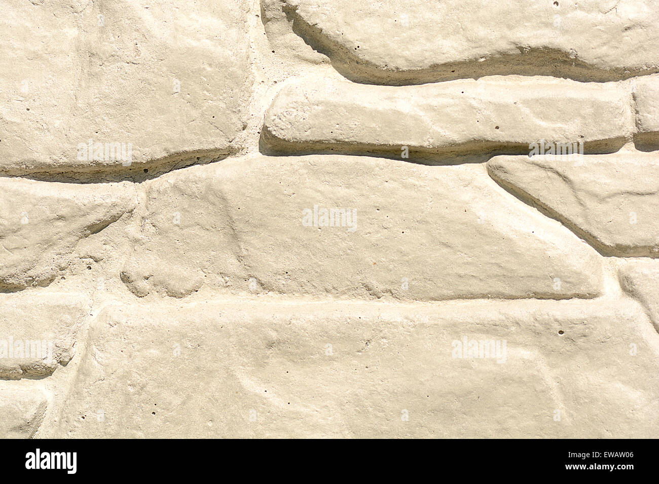 Elegant stone wall from small square parts Stock Photo - Alamy