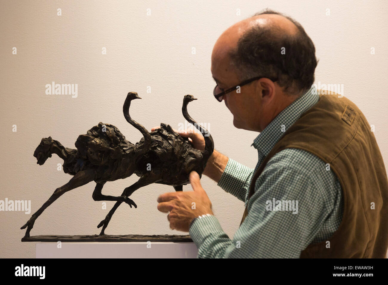 London, UK. 20 June 2015. Sculptor Mark Coreth makes final preparations ...