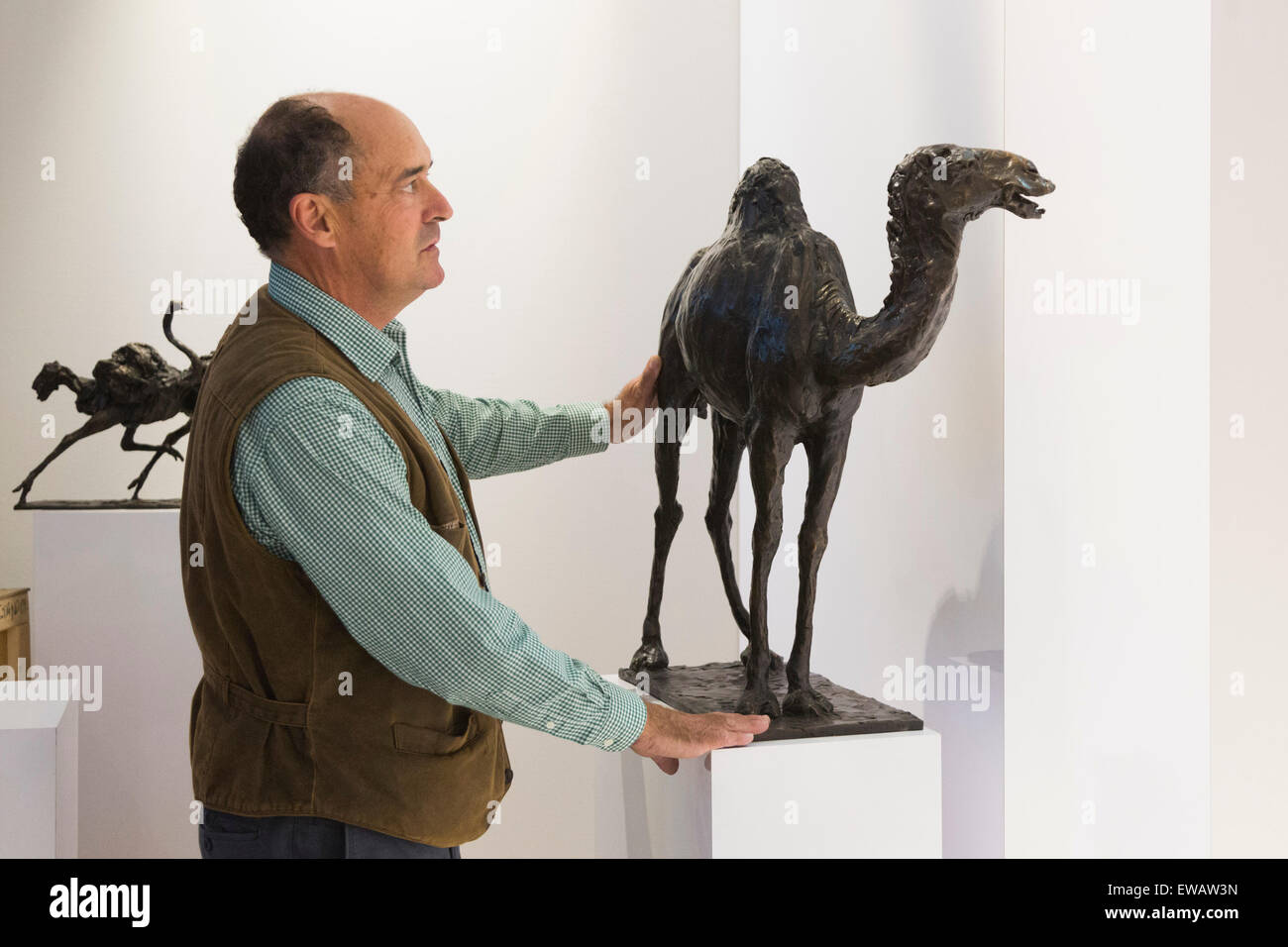 London, UK. 20 June 2015. Sculptor Mark Coreth makes final preparations ...