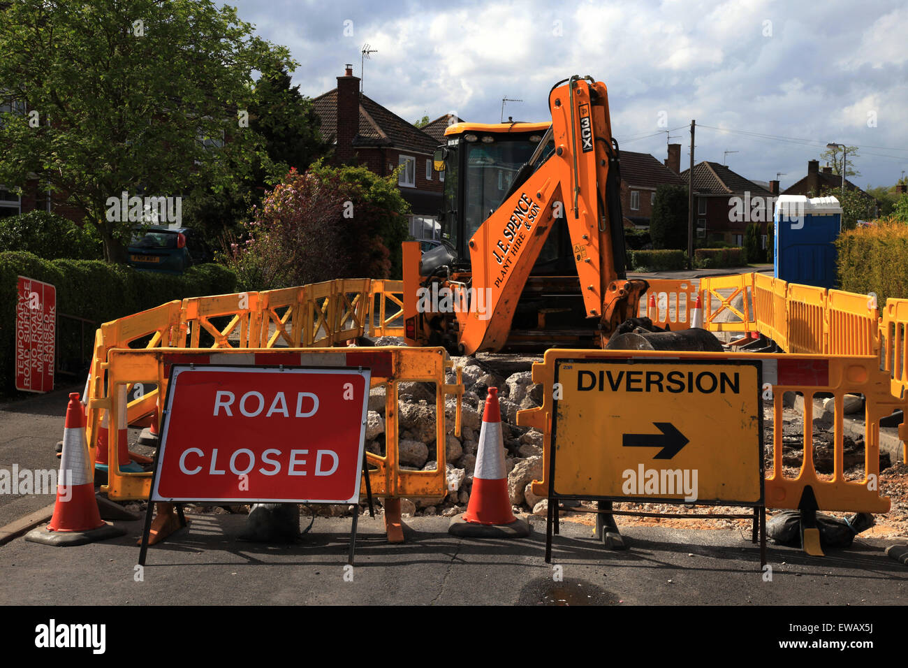 Safety barriers, cones, big hole, road, rubble concrete, tarmac ...