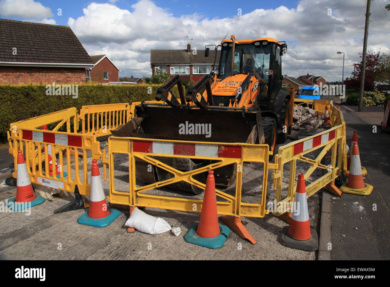 Safety barriers, cones, big hole, road, rubble concrete, tarmac ...
