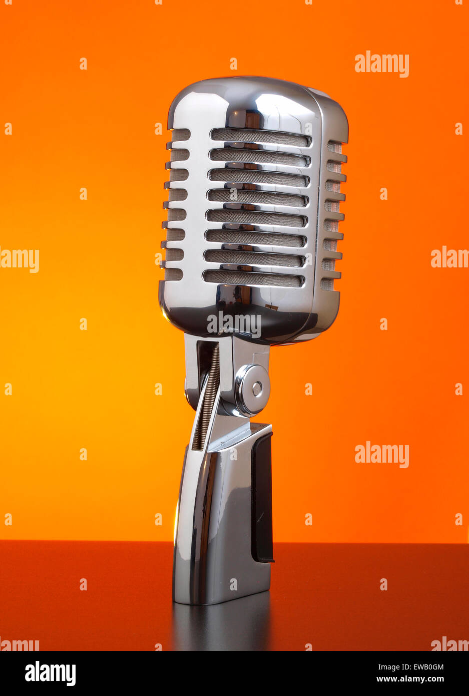 Classic microphone on orange background in a studio shot Stock Photo ...