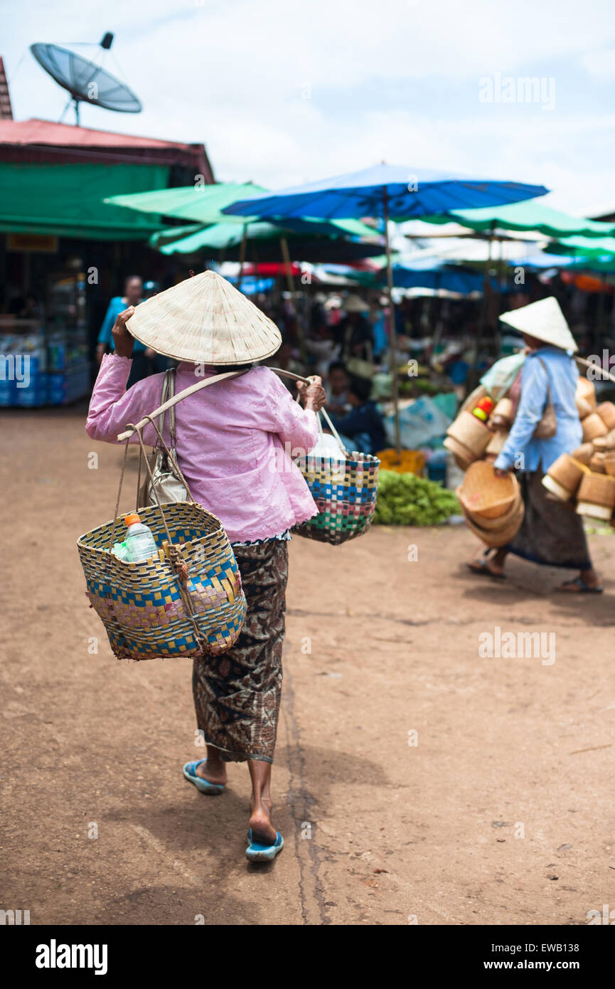 PAKSE, LAOS View of a market in Pakse is the third most populous city ...