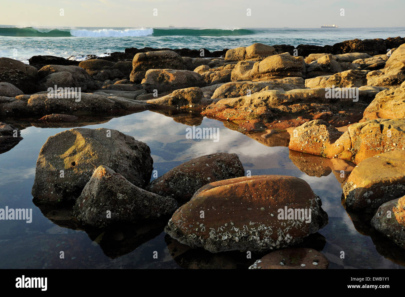 Scenic seascape of reflections in beautiful rock pool Stock Photo - Alamy
