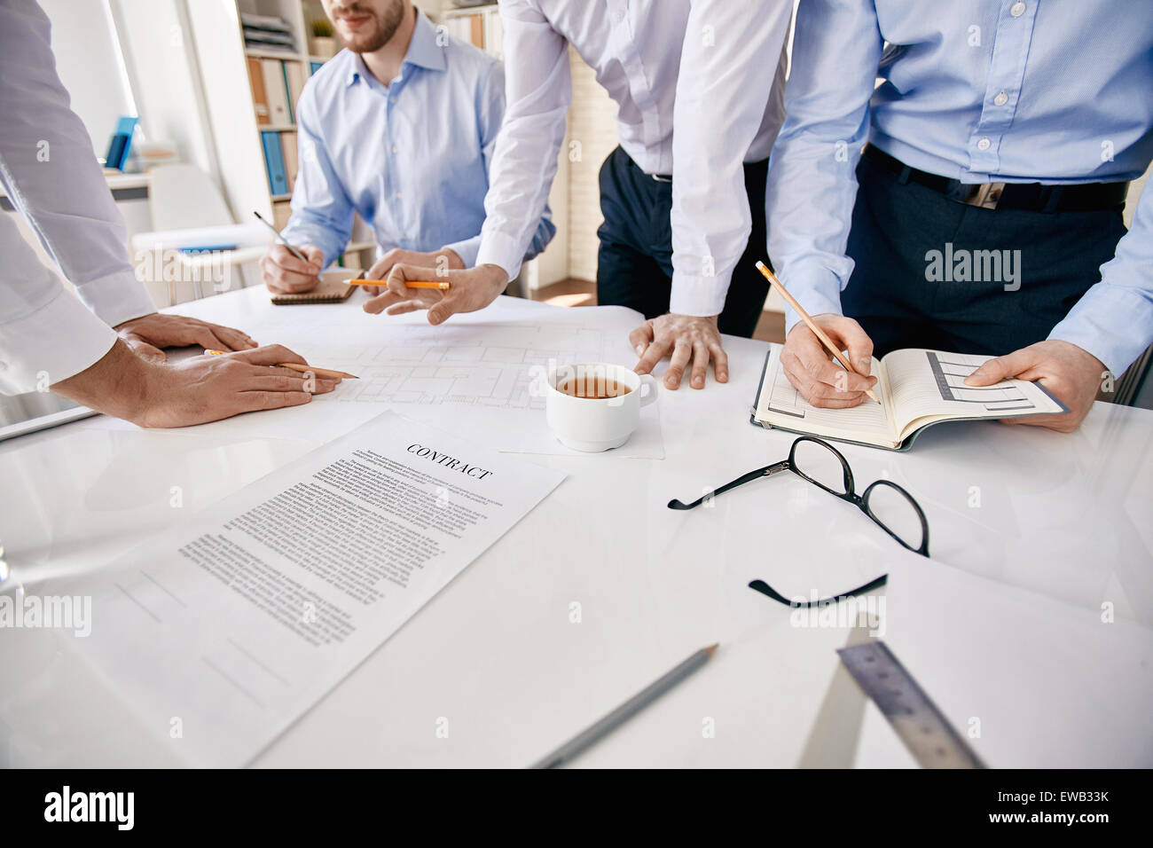 Group of architects during discussion of their work Stock Photo - Alamy