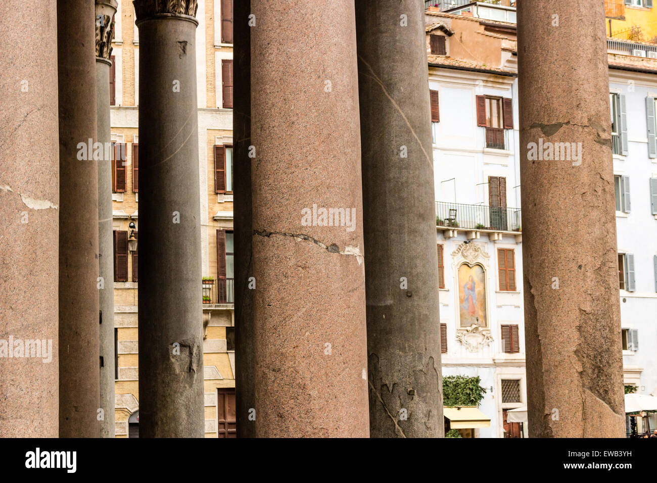 Windows of historical building thorough the columns of the Pantheon in ...