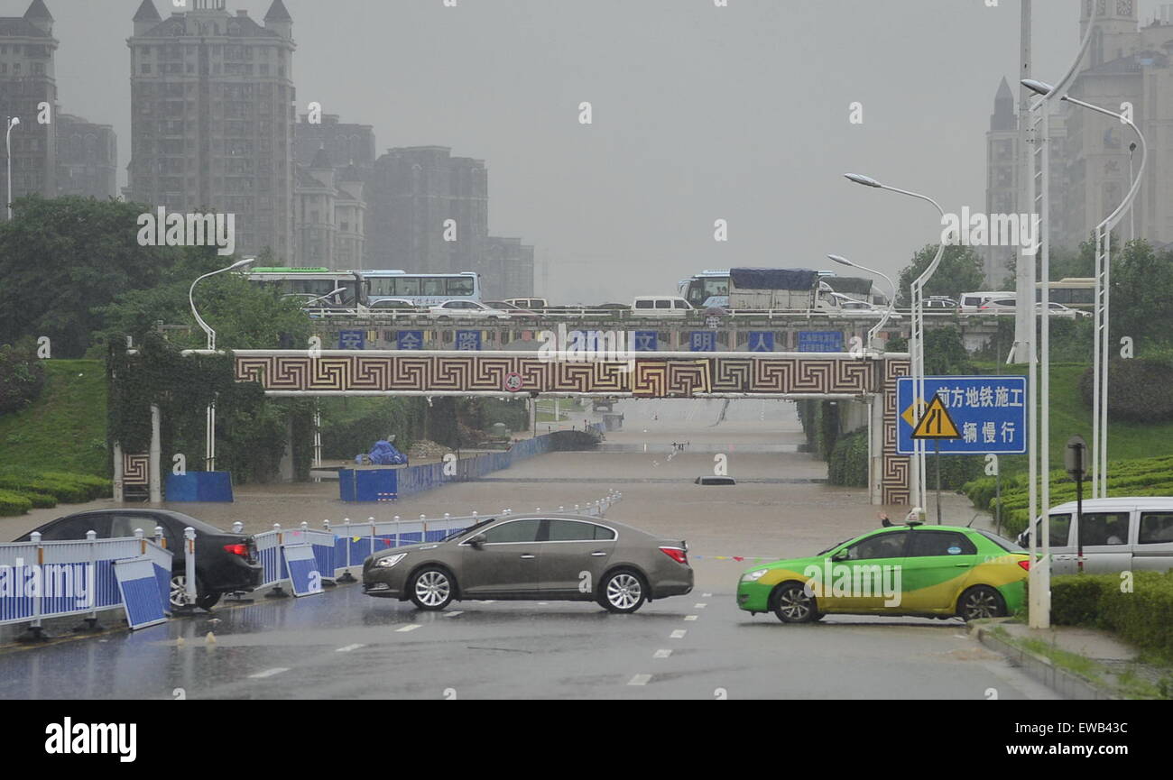 Nanchang, China's Jiangxi Province. 22nd June, 2015. Cars run across a ...