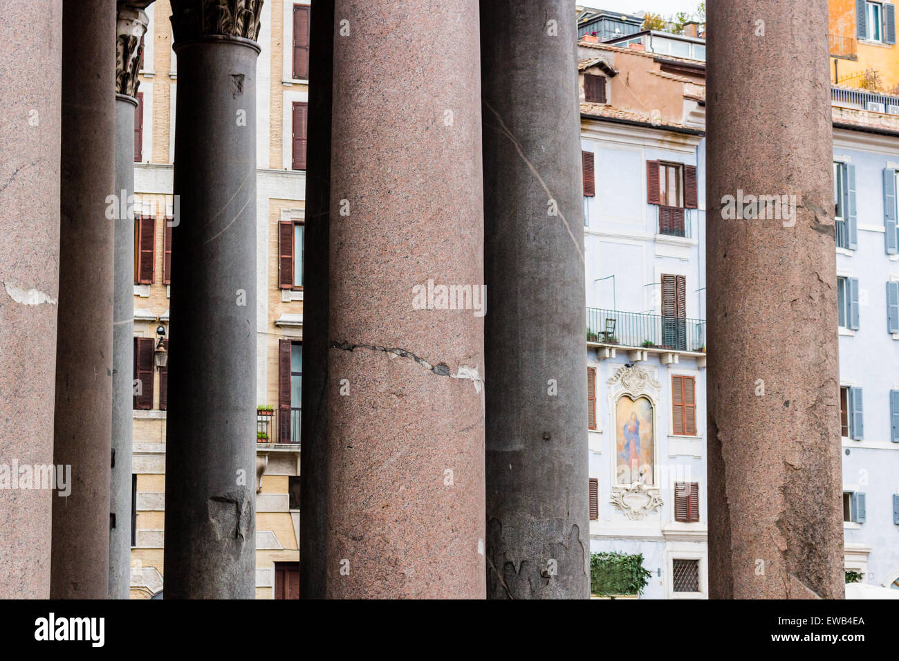 Windows of historical building thorough the columns of the Pantheon in ...