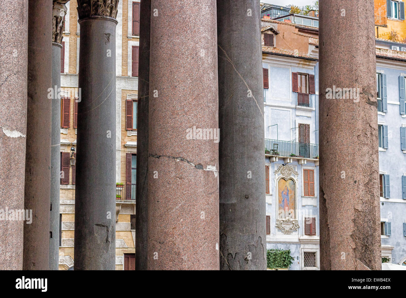 Windows of historical building thorough the columns of the Pantheon in ...