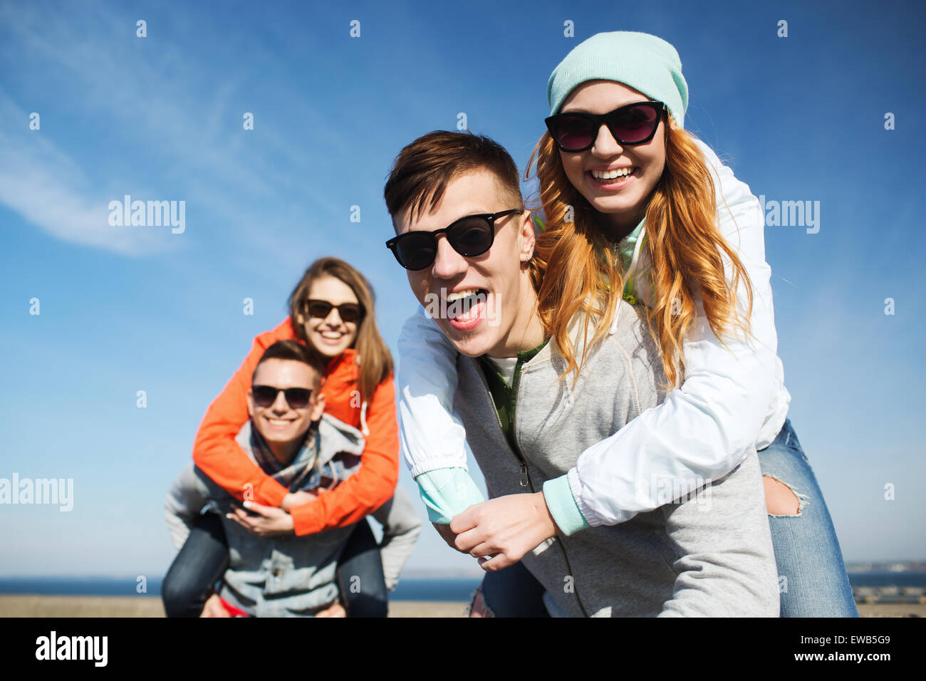 happy teenage friends having fun outdoors Stock Photo - Alamy