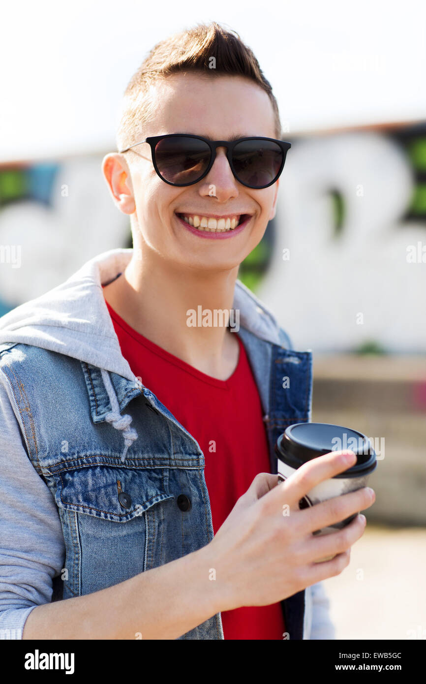 smiling young man or boy drinking coffee Stock Photo - Alamy