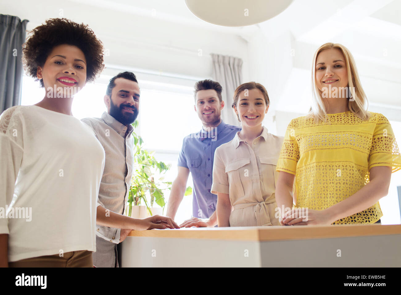 Happy team hi-res stock photography and images - Alamy